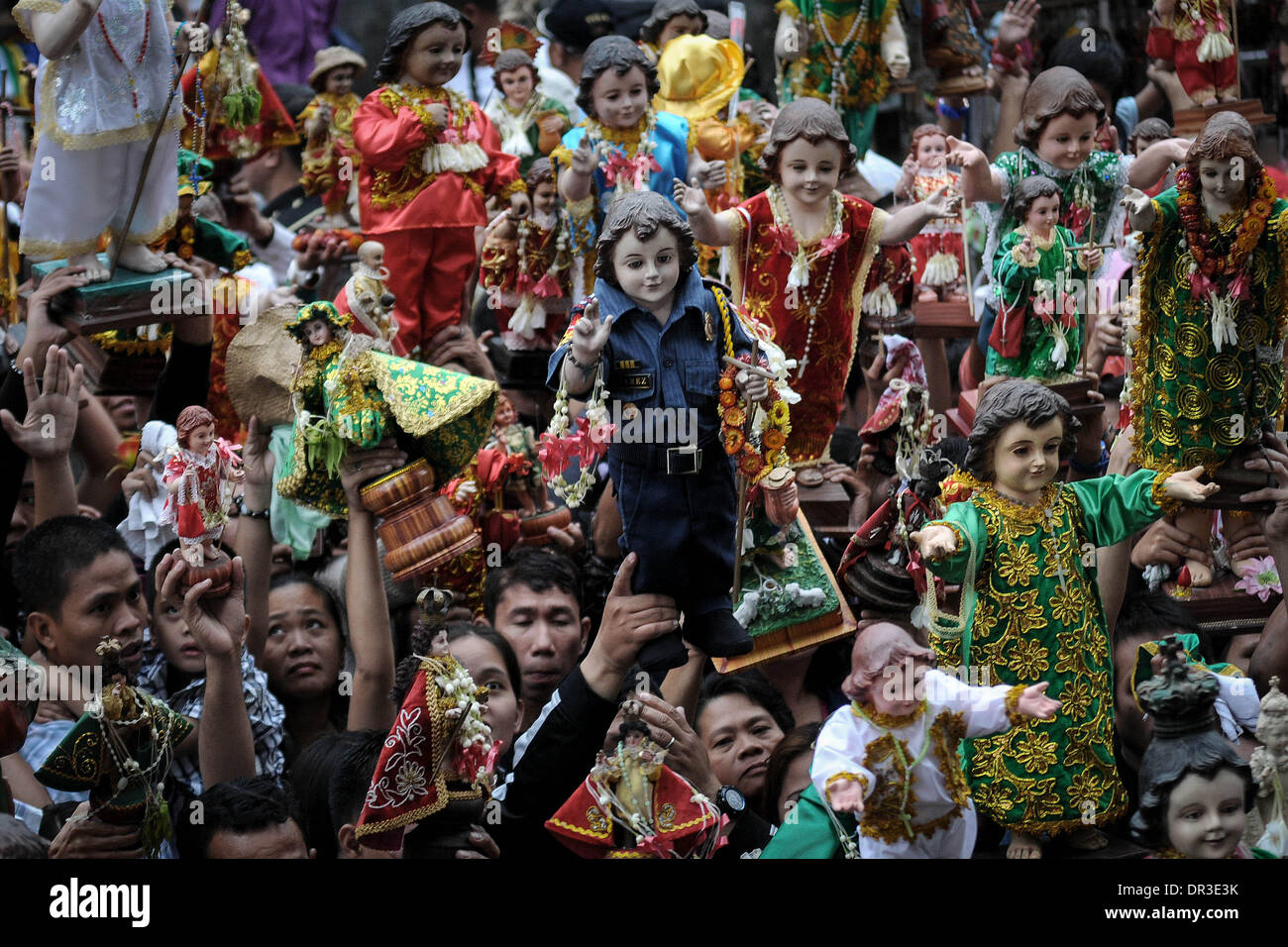 Manila, Philippines. 19th Jan, 2014. Filipino Catholics raise their ...