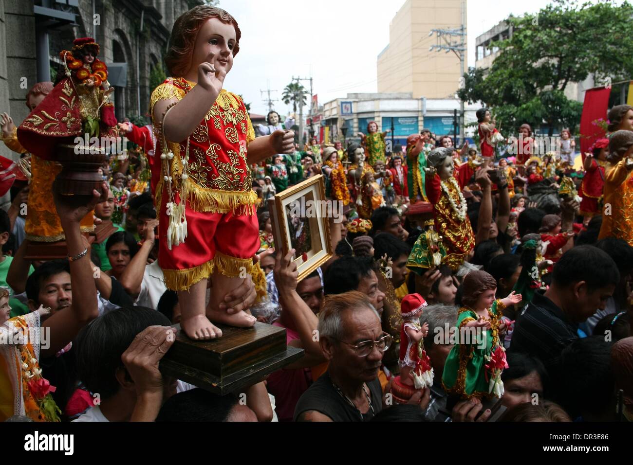 Jan. 19, 2014 - Philippines - Hundreds of Sto. Nino's carried by their ...
