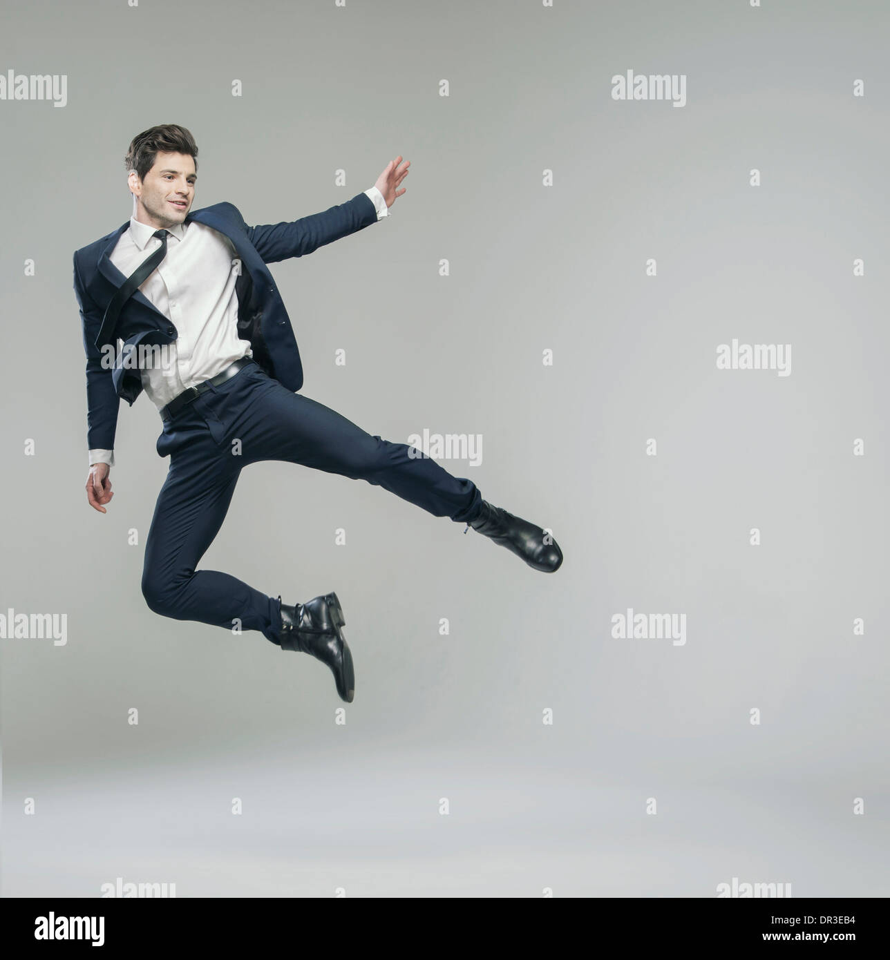 Attractive young guy in fancy pose Stock Photo - Alamy