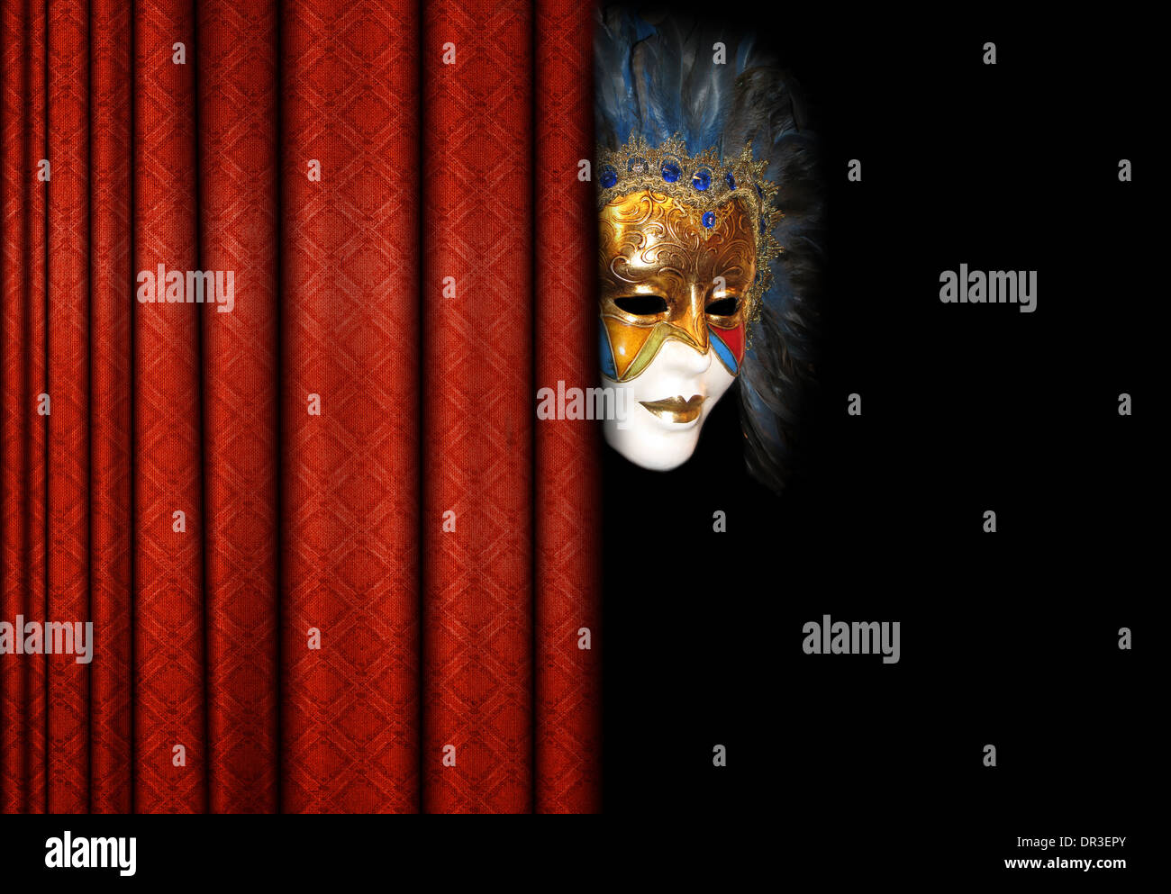 mask behind theater curtains Stock Photo - Alamy