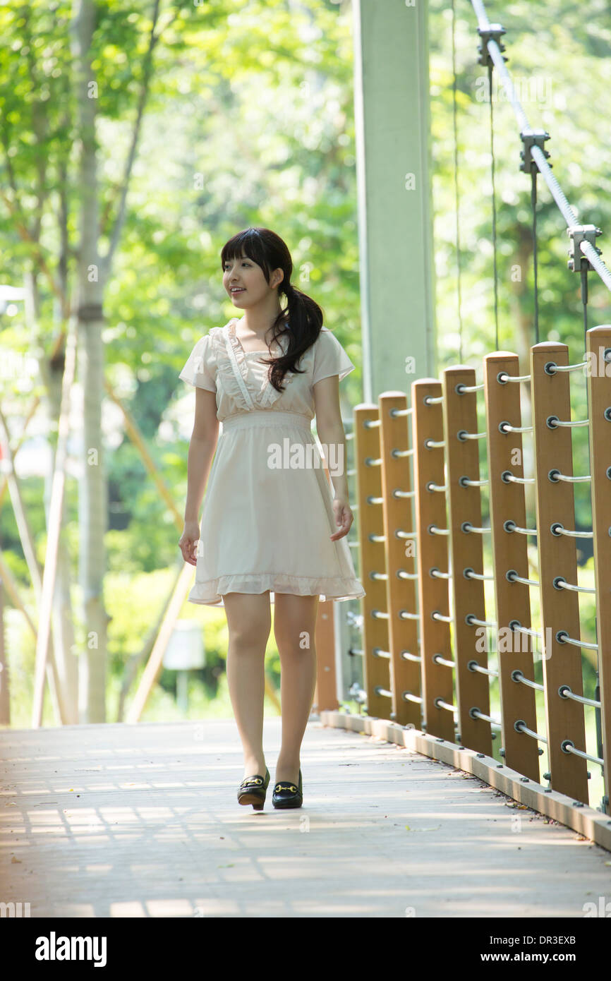 Woman bridge crossing hi-res stock photography and images - Alamy