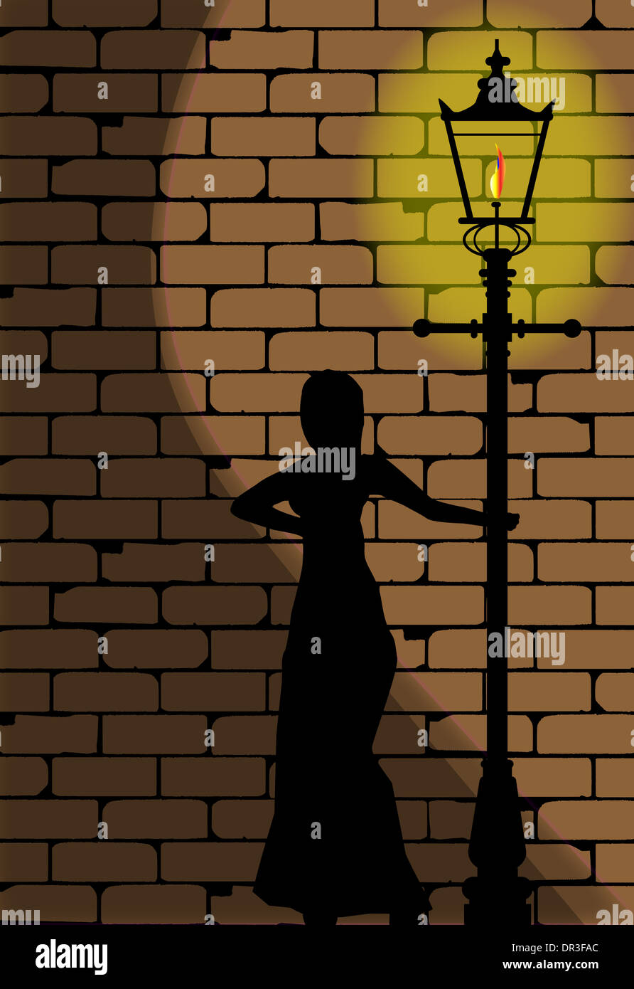 A typical old London gaslight set against a worn brick wall with shadow ...