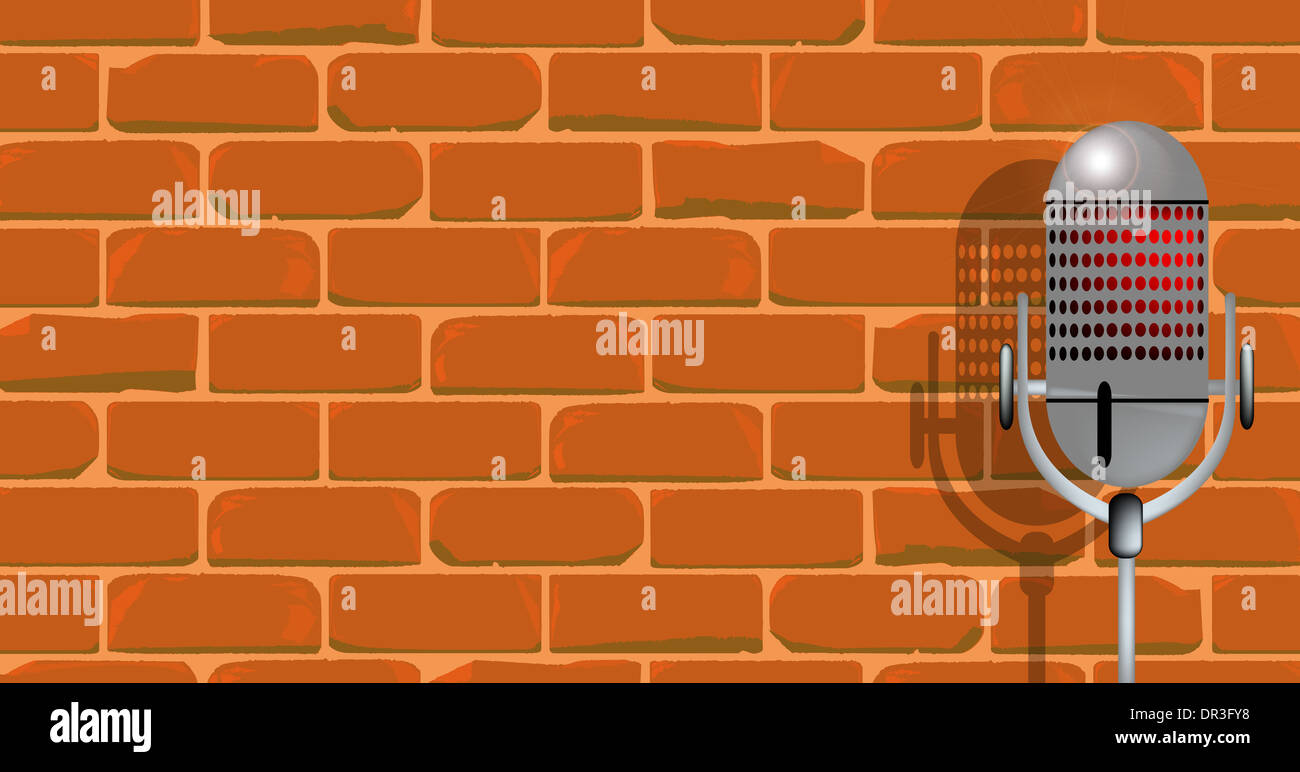 A microphone ready on stage against a brick wall Stock Photo - Alamy