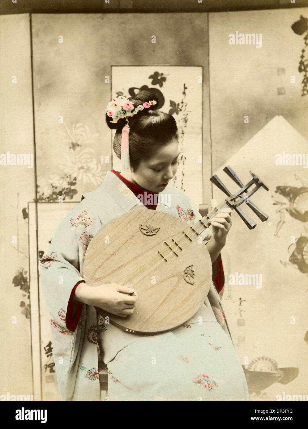 Girl playing instrument Stock Photo - Alamy