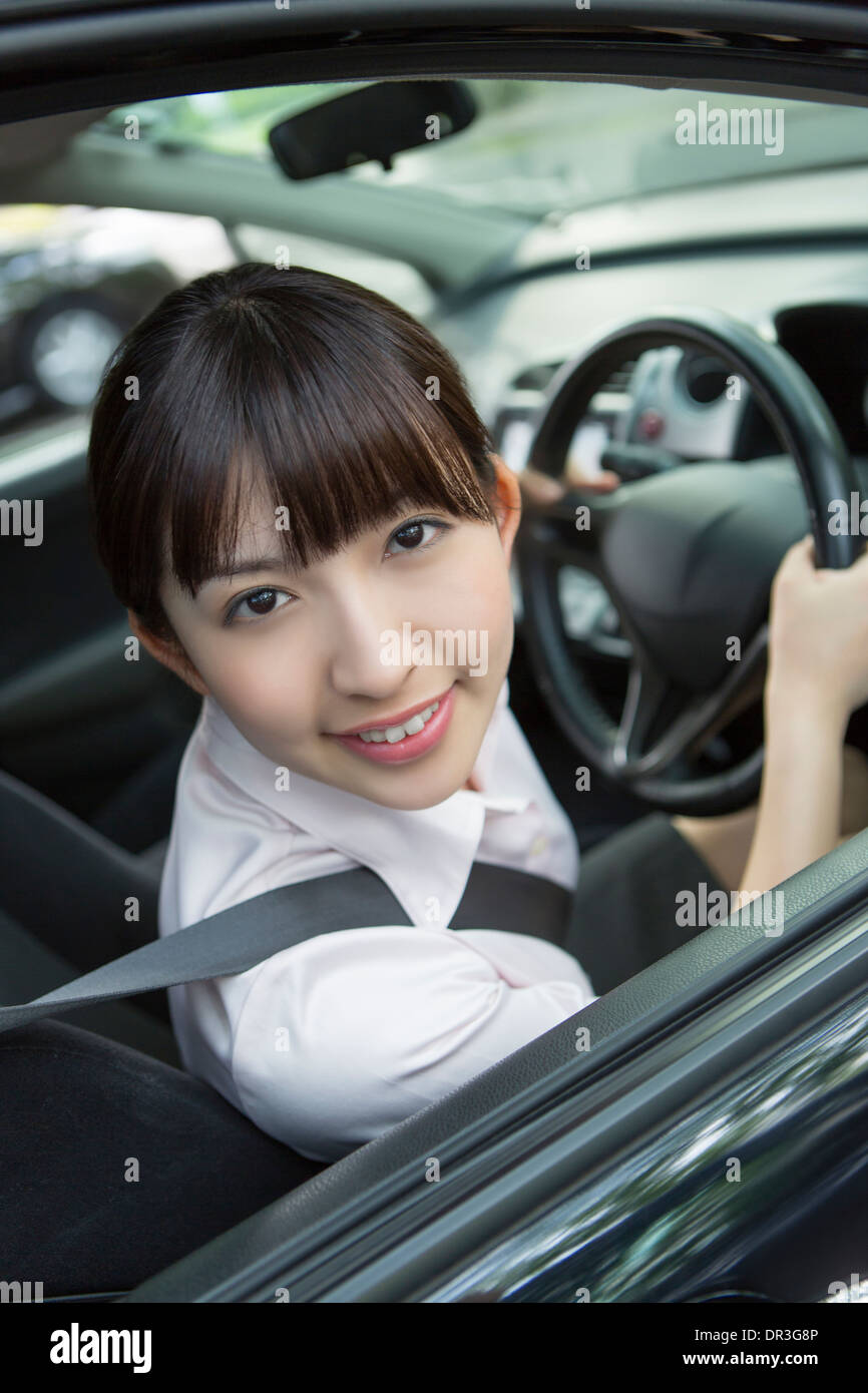 Young woman driving a car Stock Photo - Alamy