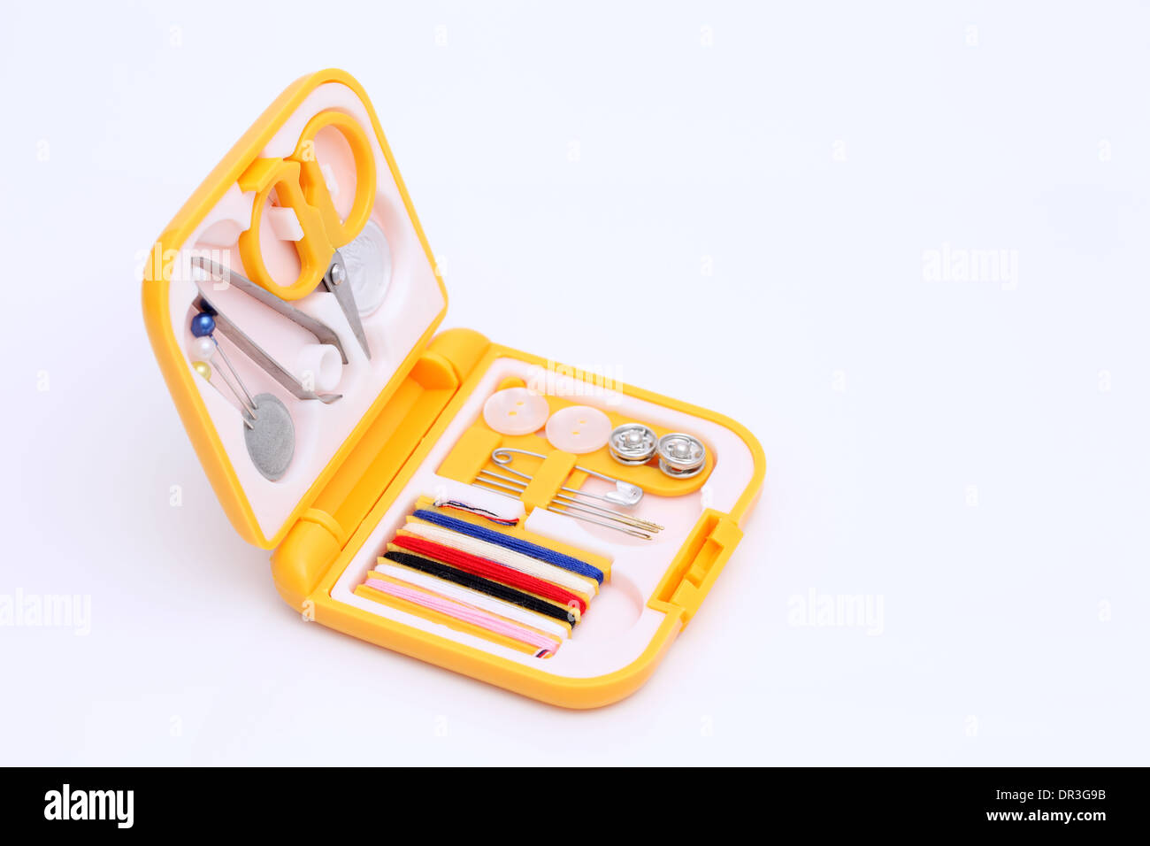 sewing kit on white background Stock Photo - Alamy