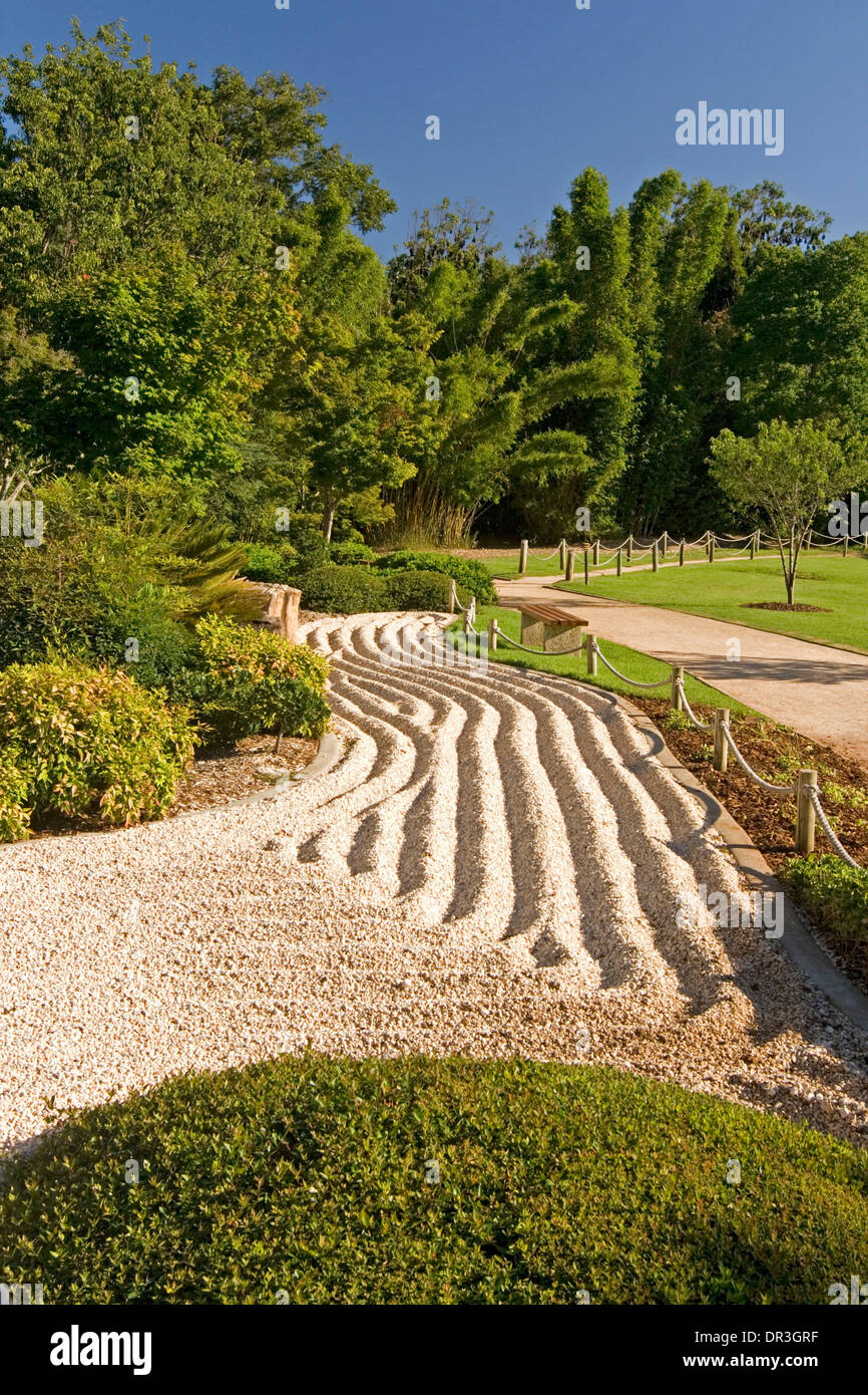 Gravel, pathways, pool and lush vegetation in Japanese gardens ...