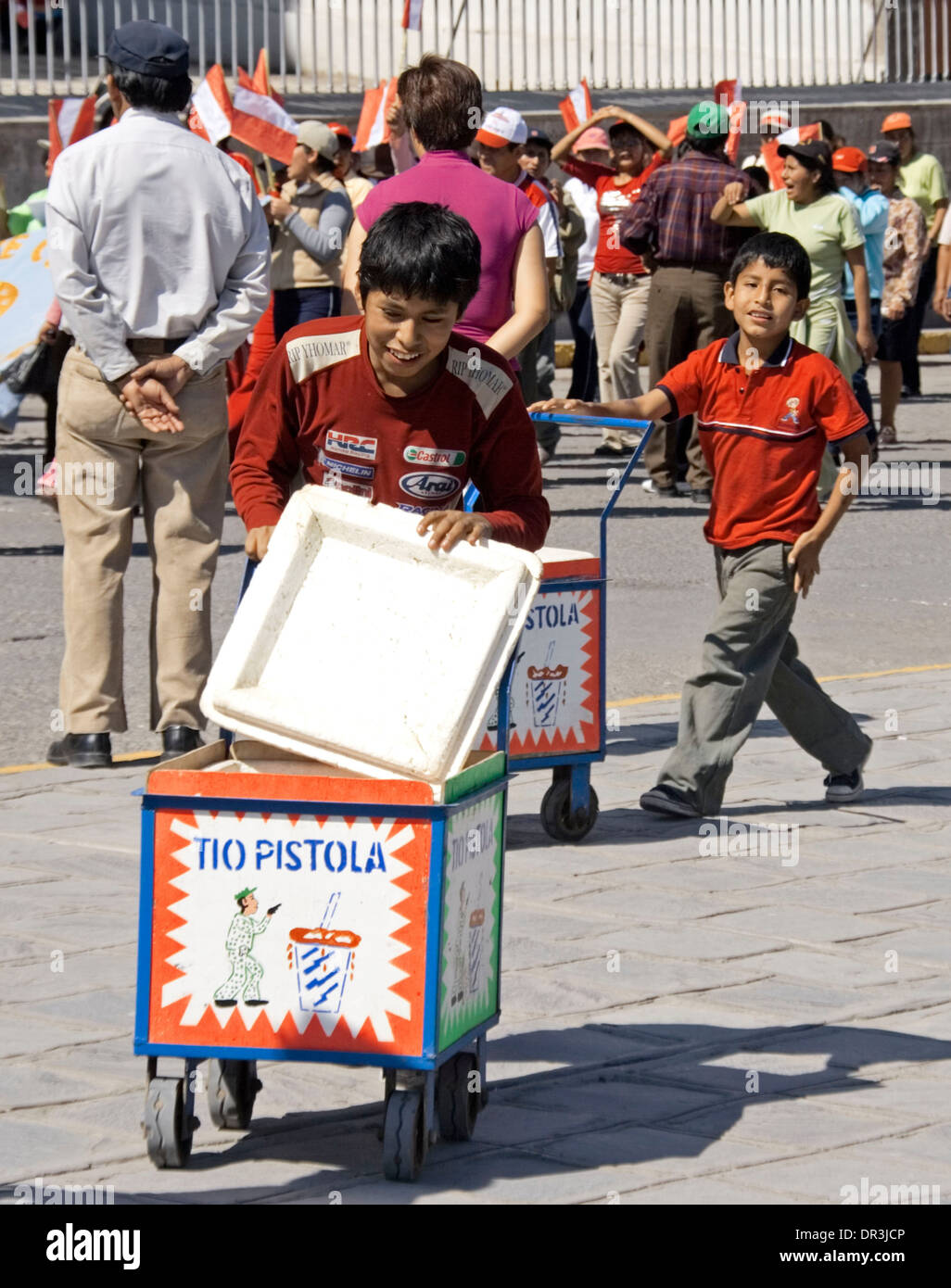 Street vendors , young boys selling ice cream from wheeled trolleys in ...