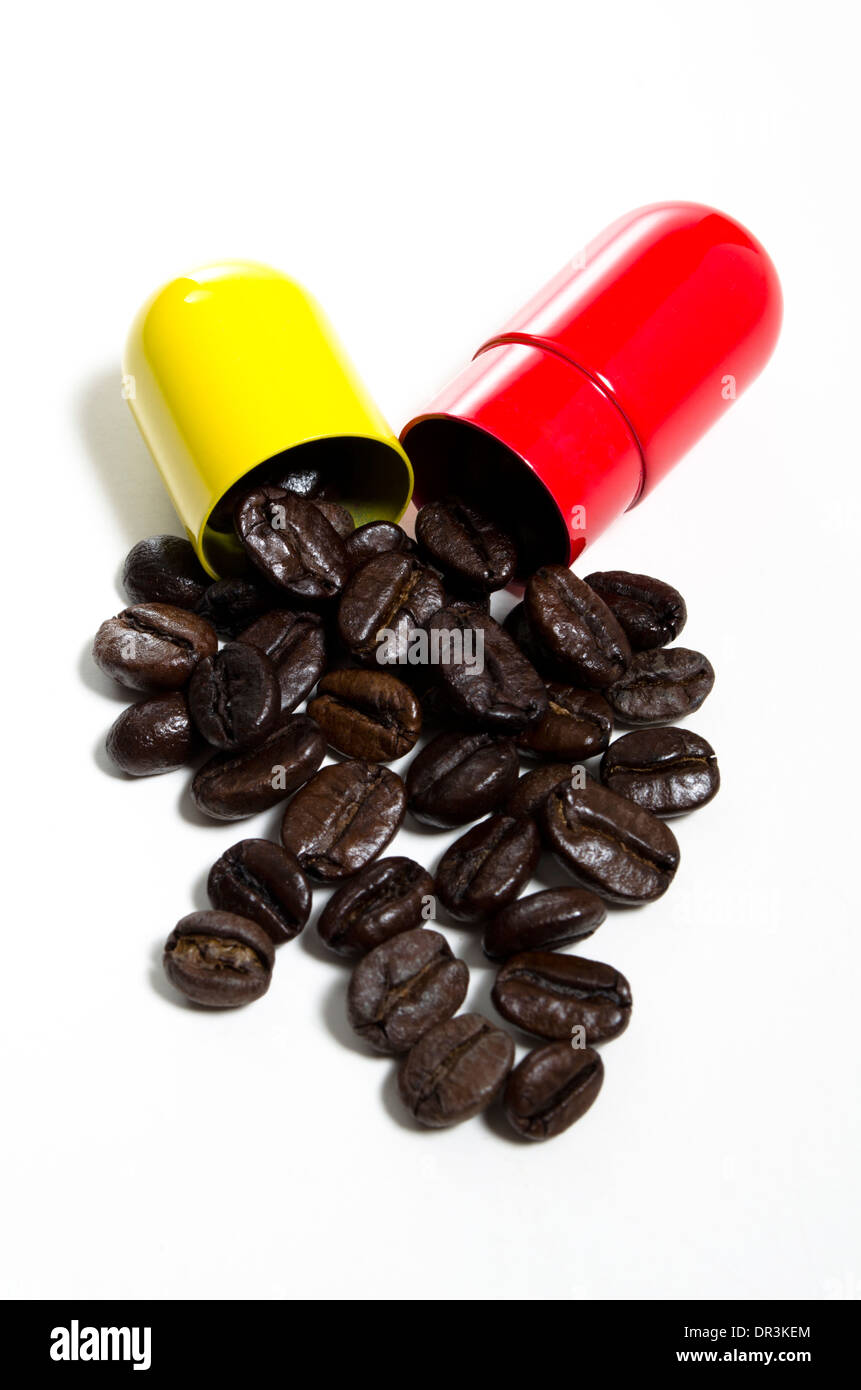 Pill filled with coffee beans Stock Photo - Alamy