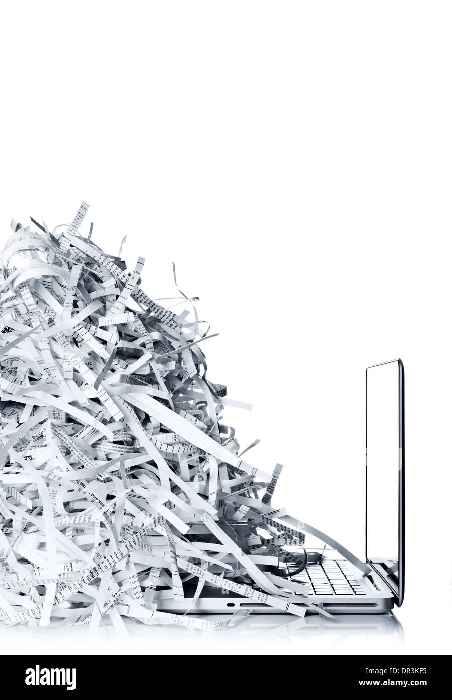 Saving paper. Laptop computer and shredded paper Stock Photo - Alamy