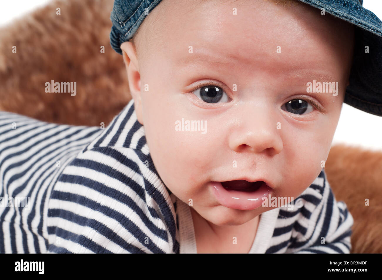 Newborn baby in striped clothes Stock Photo - Alamy