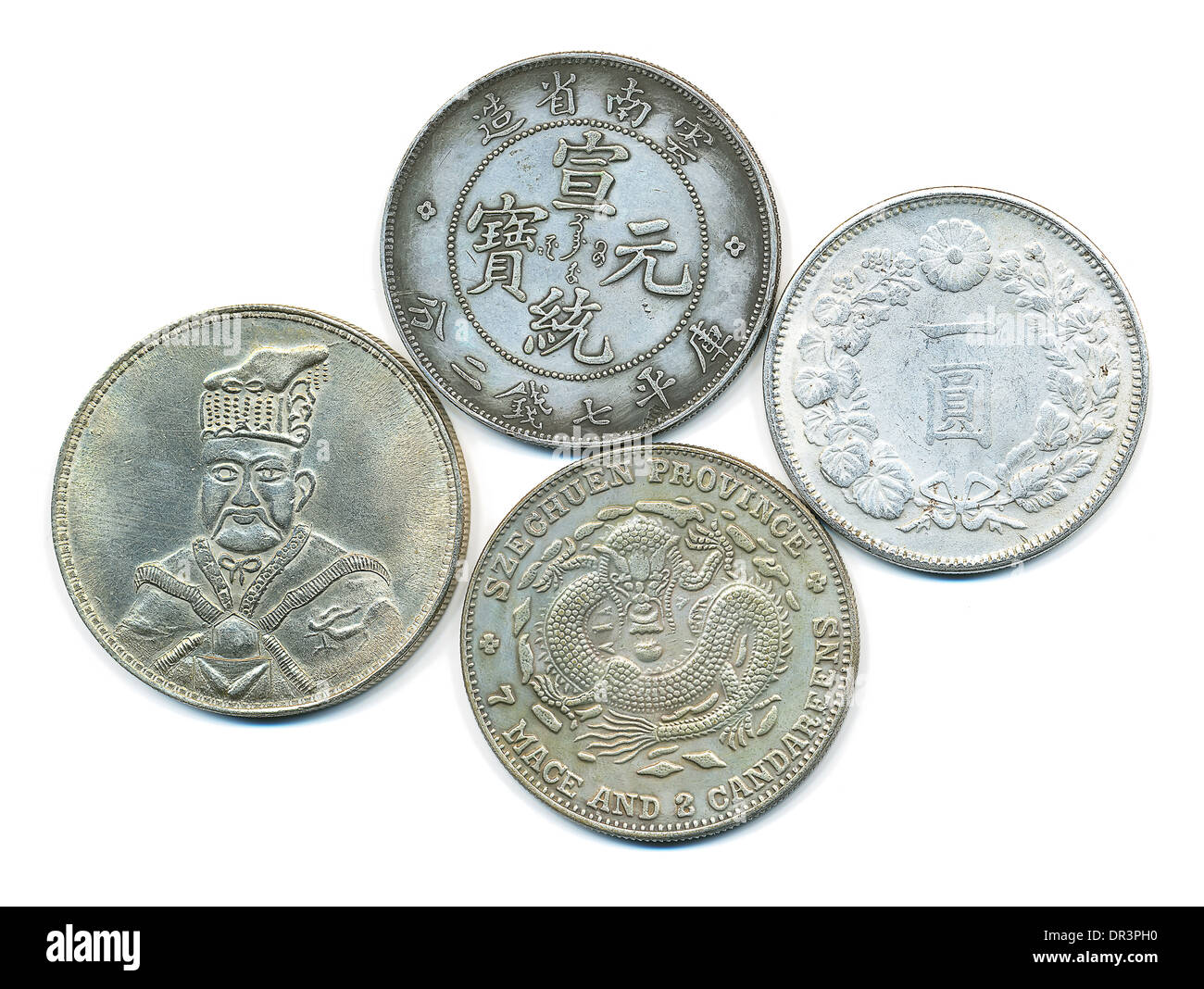 Ancient chinese silver coins isolated on white Stock Photo - Alamy