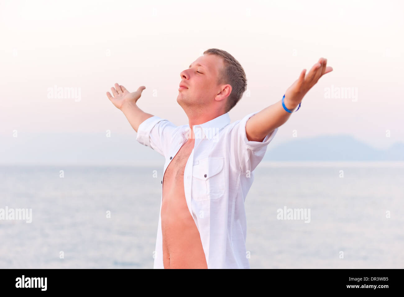 man arms outstretched enjoying the freedom Stock Photo - Alamy