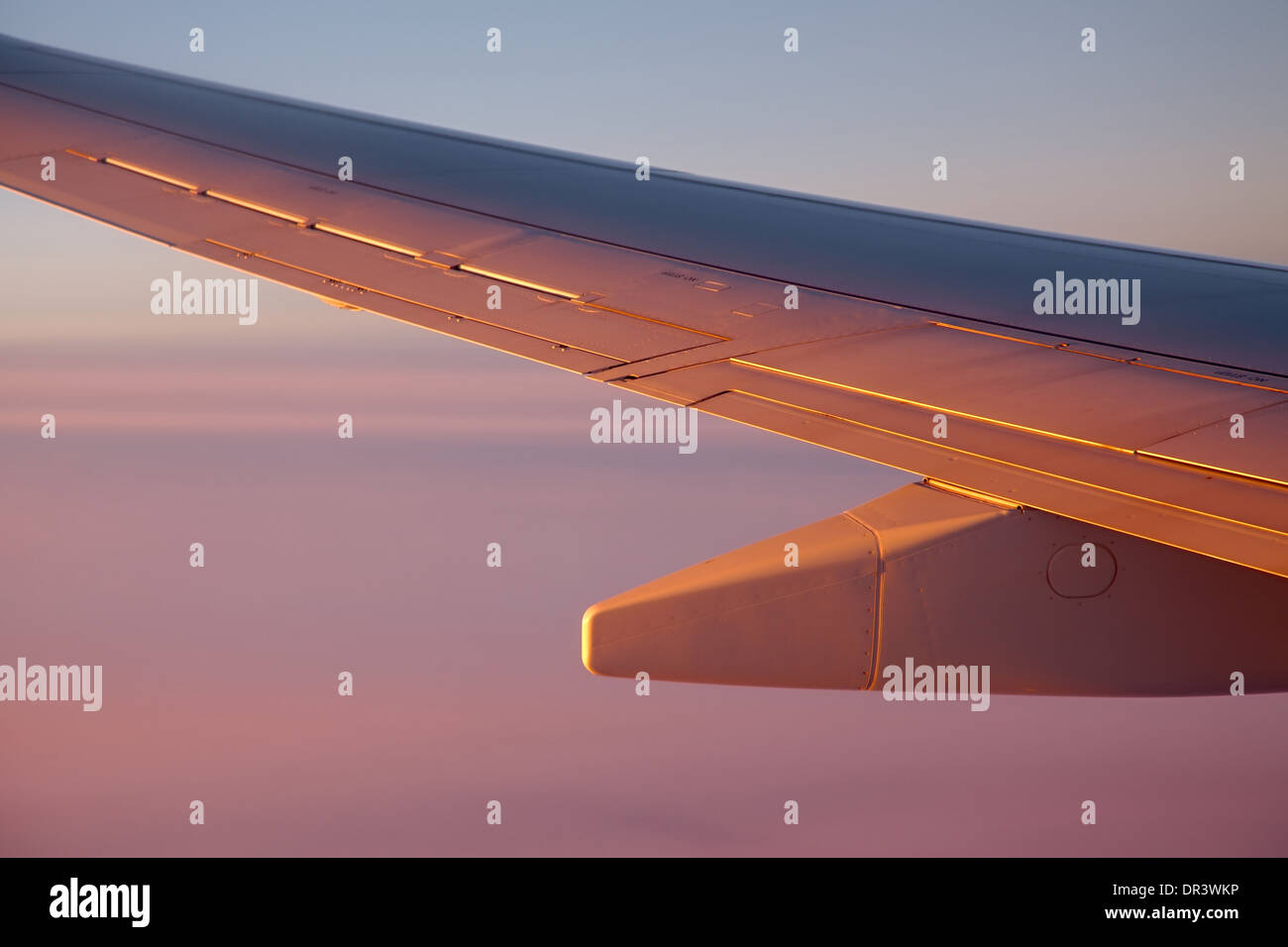 Wing airplane flying above morning hi-res stock photography and images ...