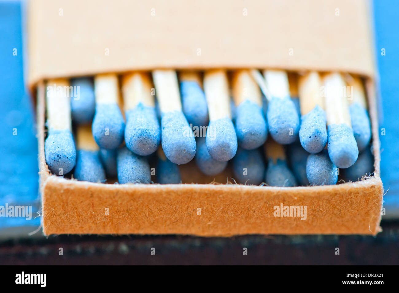 matchbox with blue heads closeup Stock Photo - Alamy