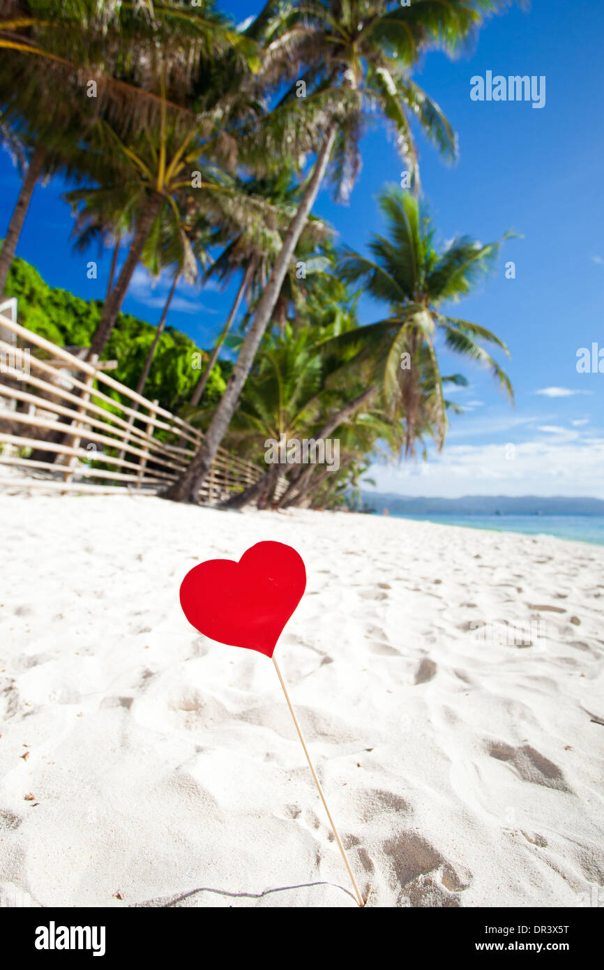 Red heart on white sand beach Stock Photo - Alamy