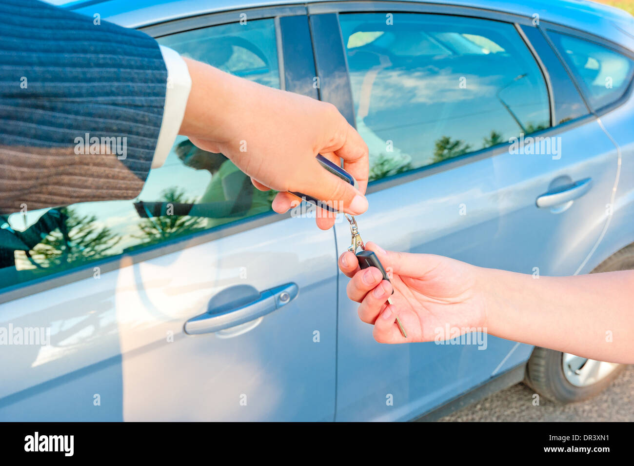 Handing car keys hi-res stock photography and images - Alamy