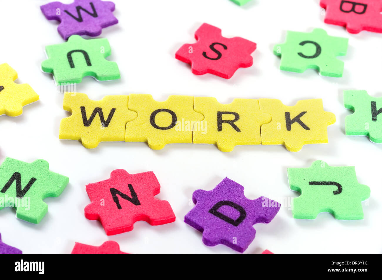 word WORK formed with colorful foam puzzle on white background Stock ...