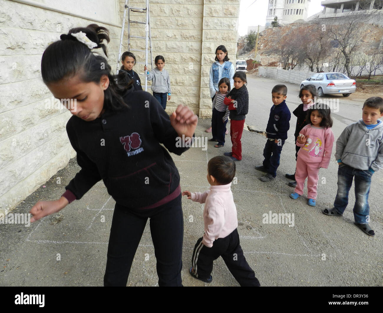 Refugee children play near hi-res stock photography and images - Alamy