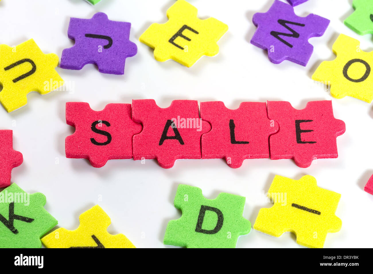 word SALE formed with colorful foam puzzle on white background Stock ...