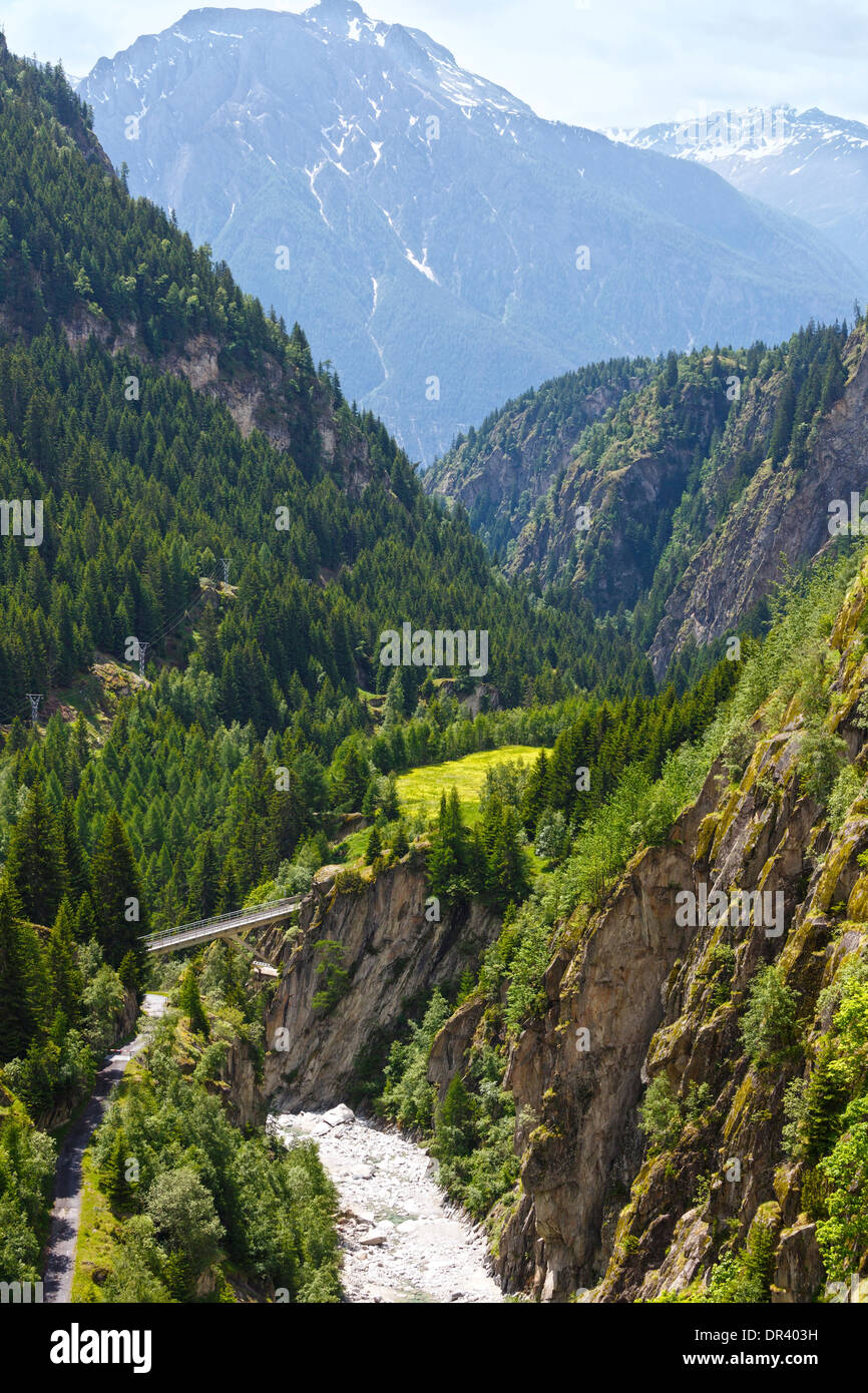 Summer mountain landscape with bridge across ravine (Alps, Switzerland ...