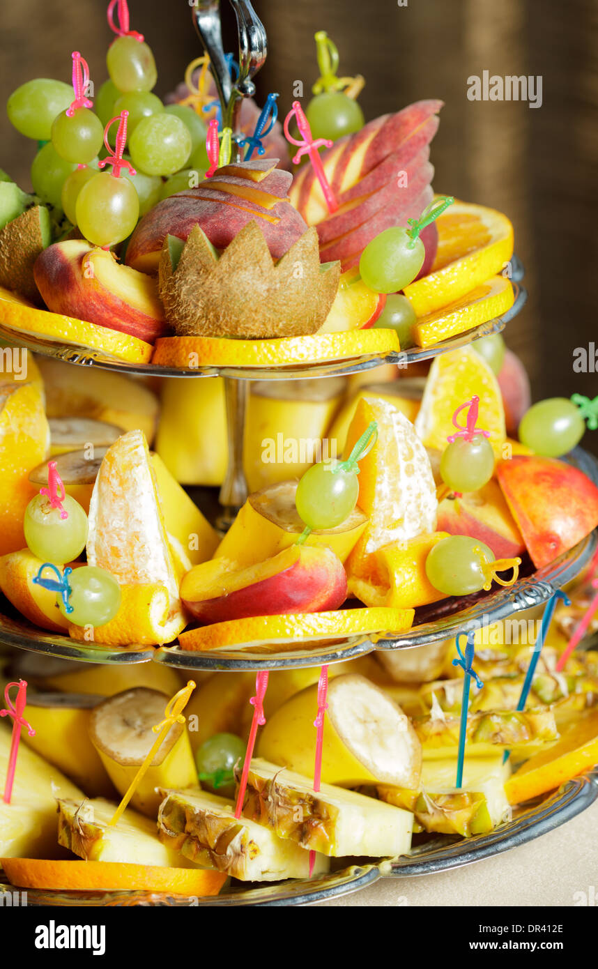Various slices of fruits on the silver stand prepared for eating Stock ...