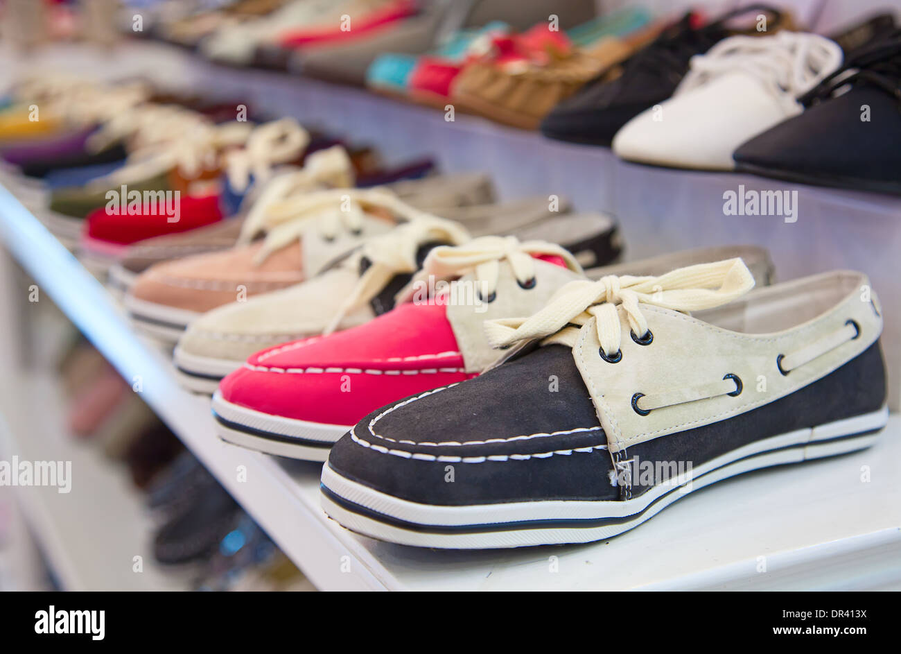variety of the colorful leather shoes in the shop Stock Photo - Alamy