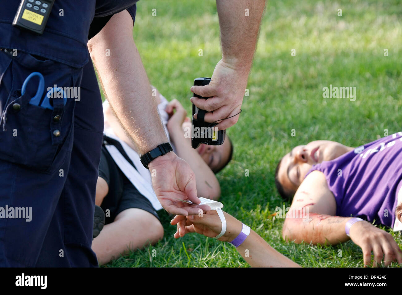 An EMT scanning a patient tracking scan code tag or band Stock Photo ...