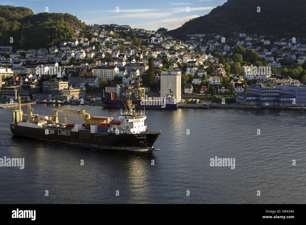 Freighter M/V Tananger passing commercial wharves in Damsgard Bergen ...