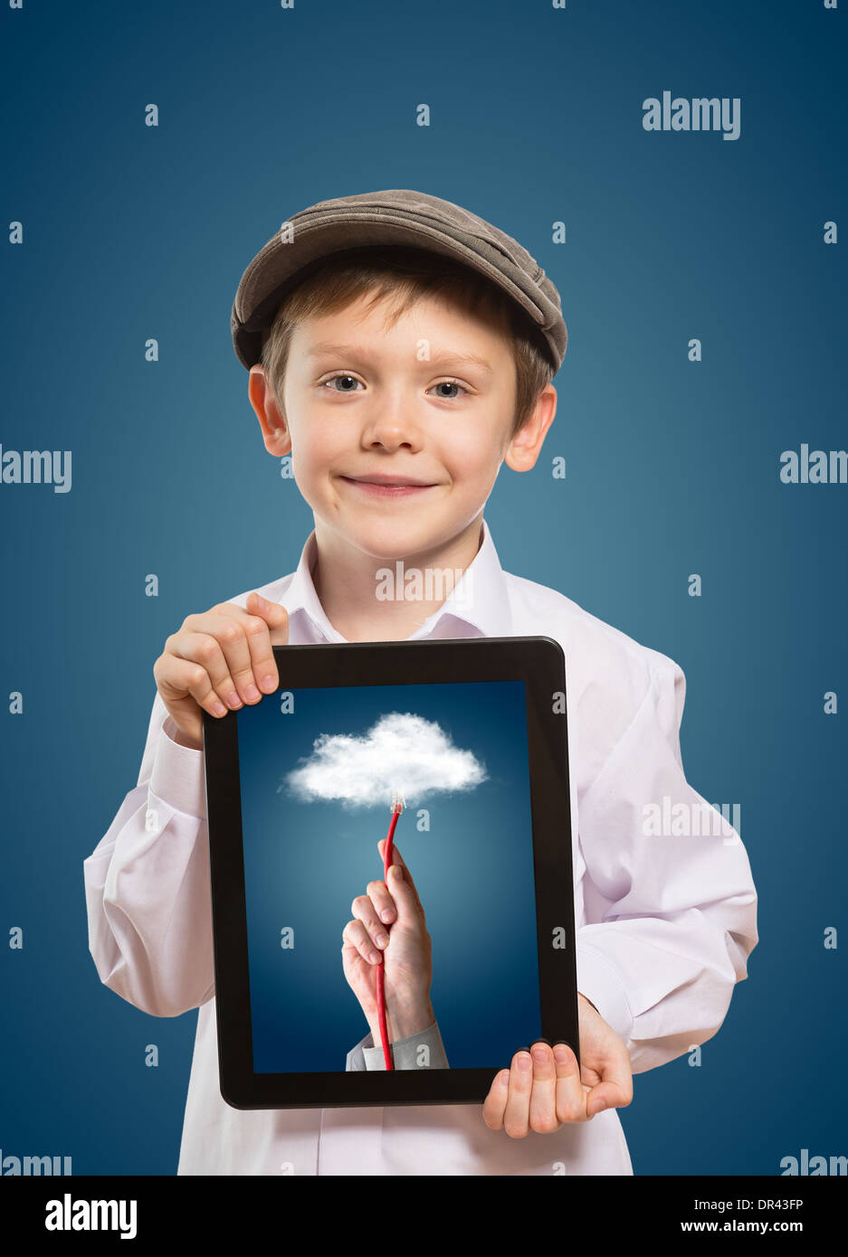 Happy boy with tablet computer. Child showing tablet Stock Photo - Alamy