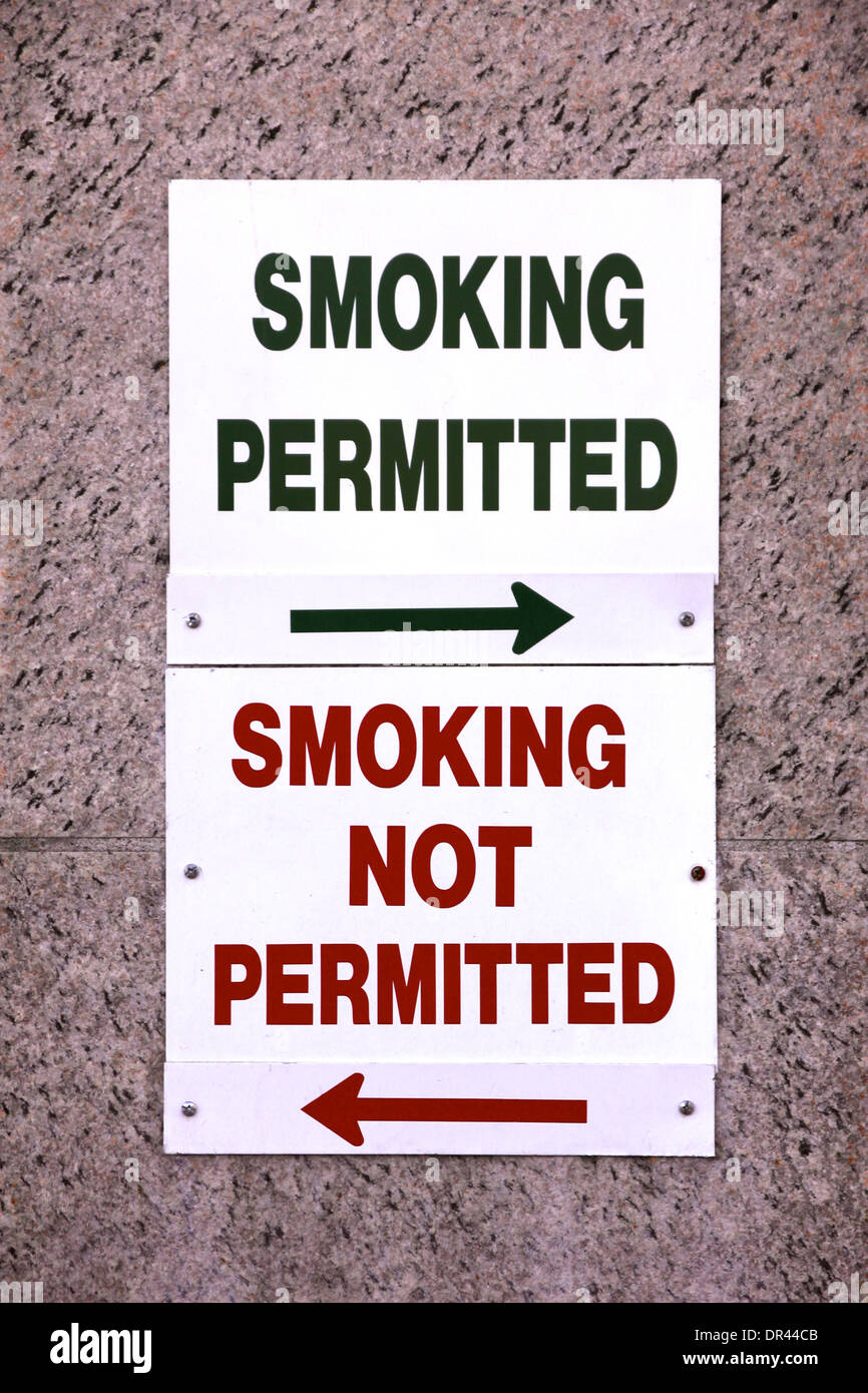 Two signs marking the border between the smoking and the non-smoking ...