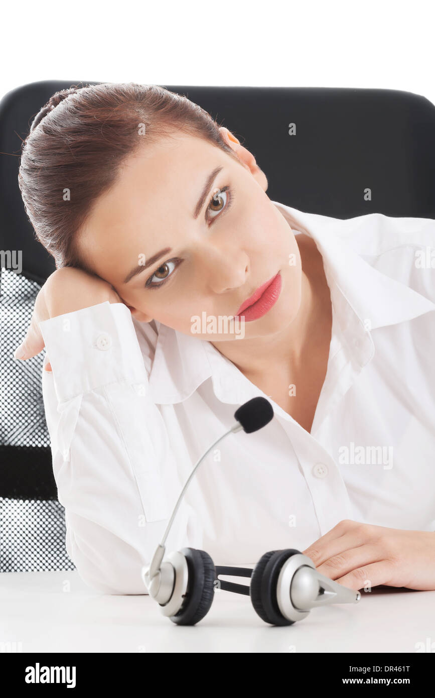 Tired, sad business woman at call center. Over white background Stock ...