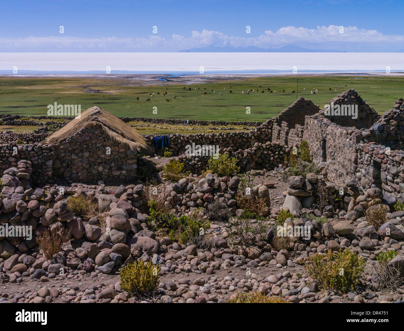 Abandoned adobe houses most without their thatched roofs in the village ...