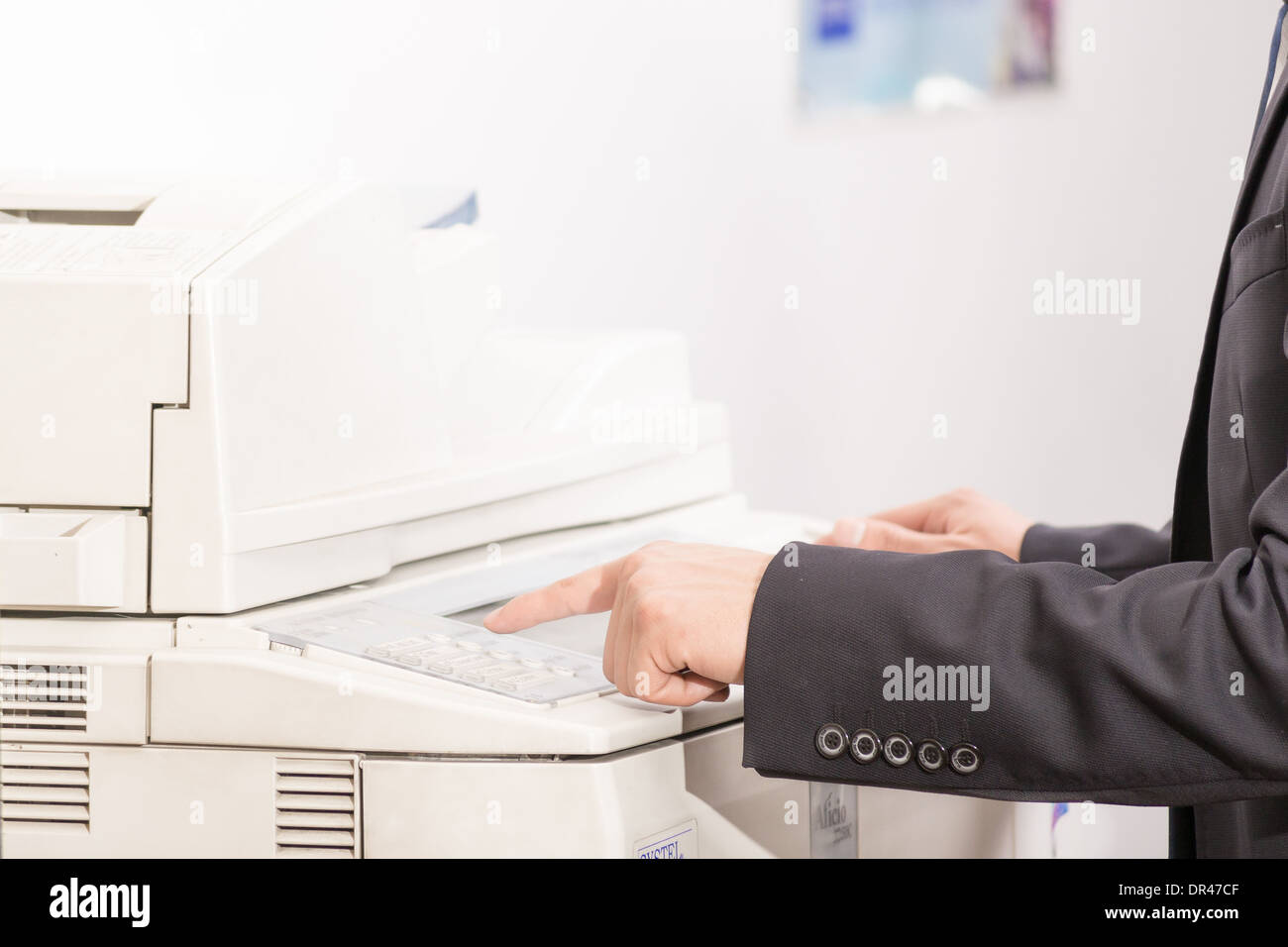 Businesswoman using photocopier hi-res stock photography and images - Alamy