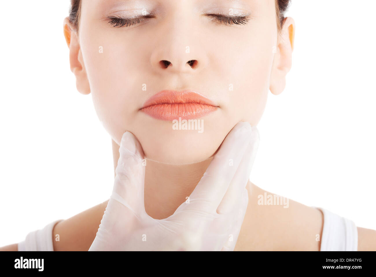 Beautiful woman is prepared to plastic surgery. Over white background ...