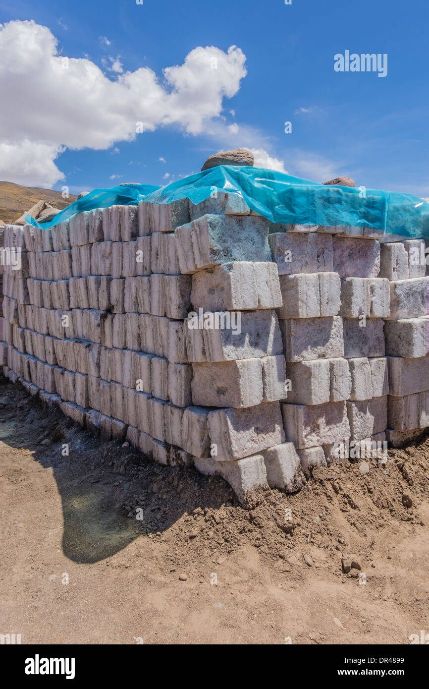 Salt blocks quarried from the Salar de Uyuni stacked waiting to be used ...
