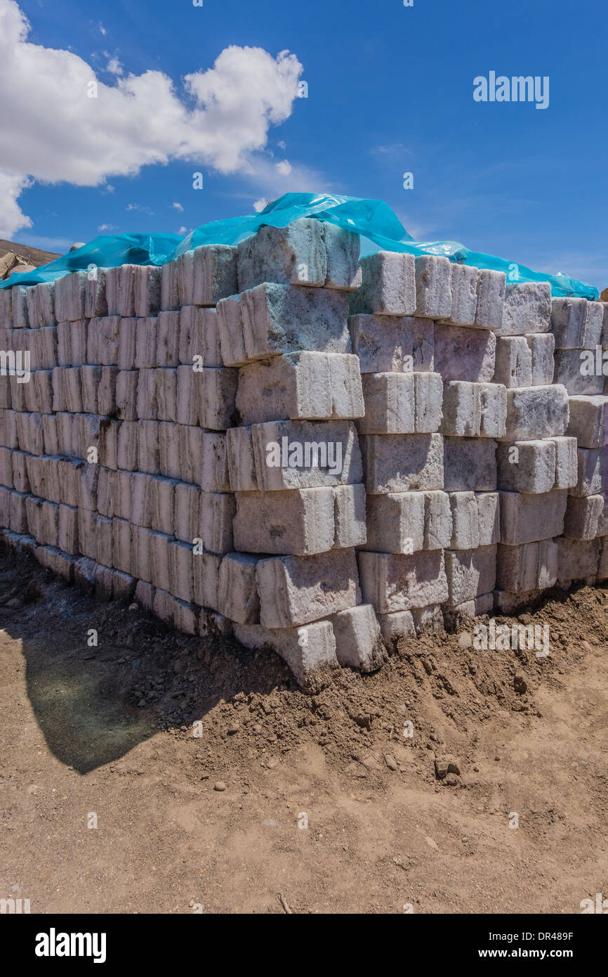 Salt blocks quarried from the Salar de Uyuni stacked waiting to be used ...
