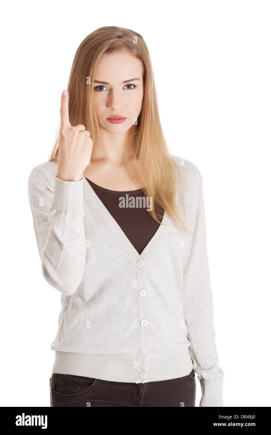 Beautiful woman is showing one finger in a warning. Isolated on white ...