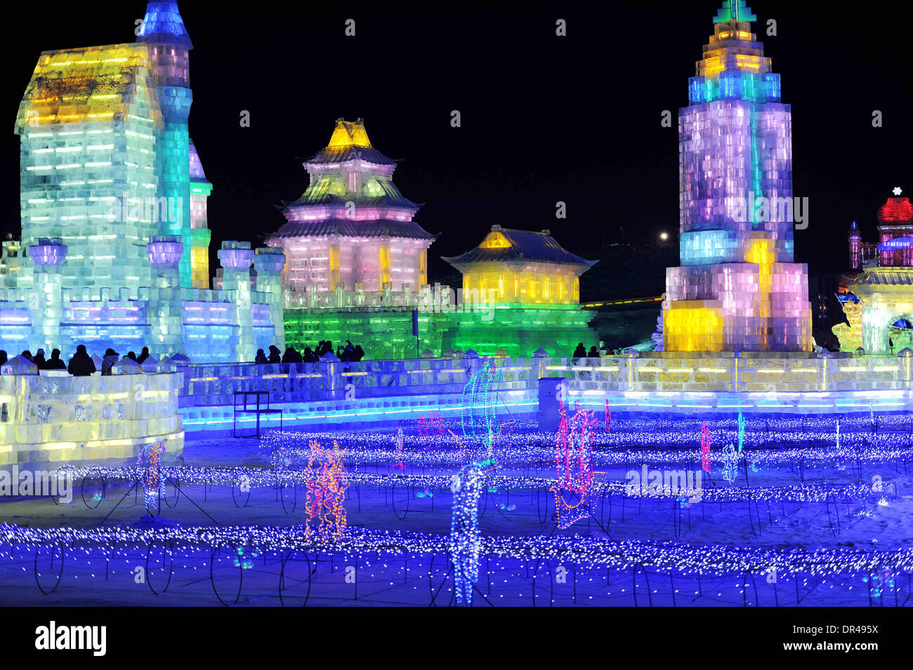 Harbin, China's Heilongjiang Province. 20th Jan, 2014. Tourists enjoy ...