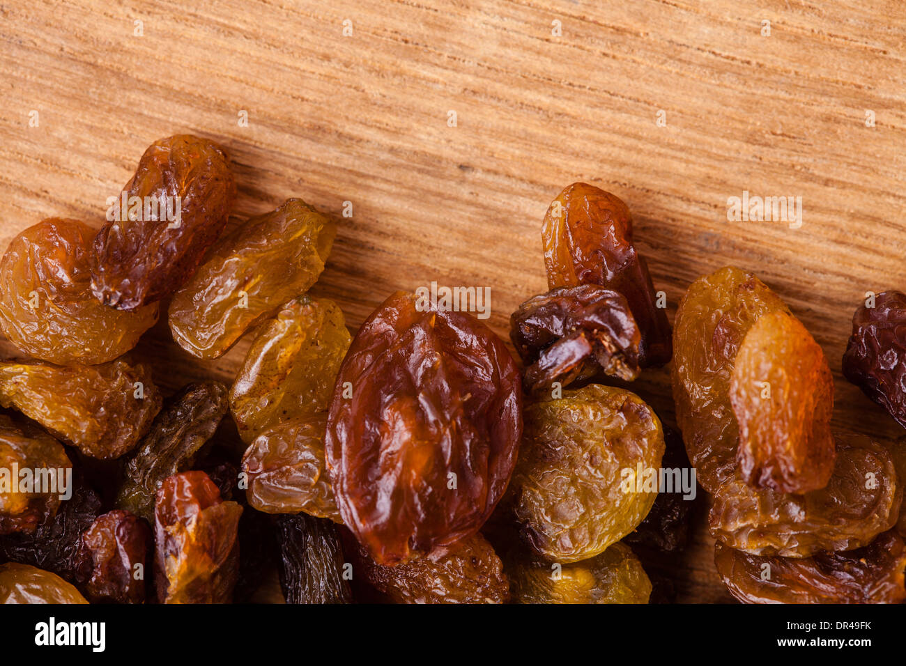 Healthy food organic nutrition. Border frame of raisin on wooden table ...