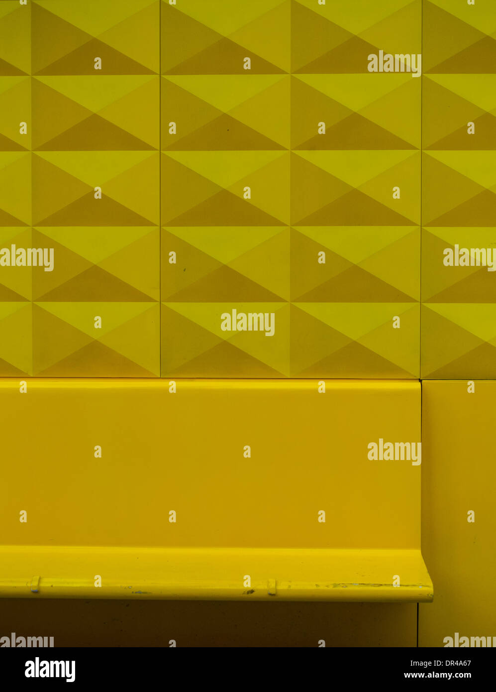 Bright yellow bench against yellow tile Stock Photo - Alamy