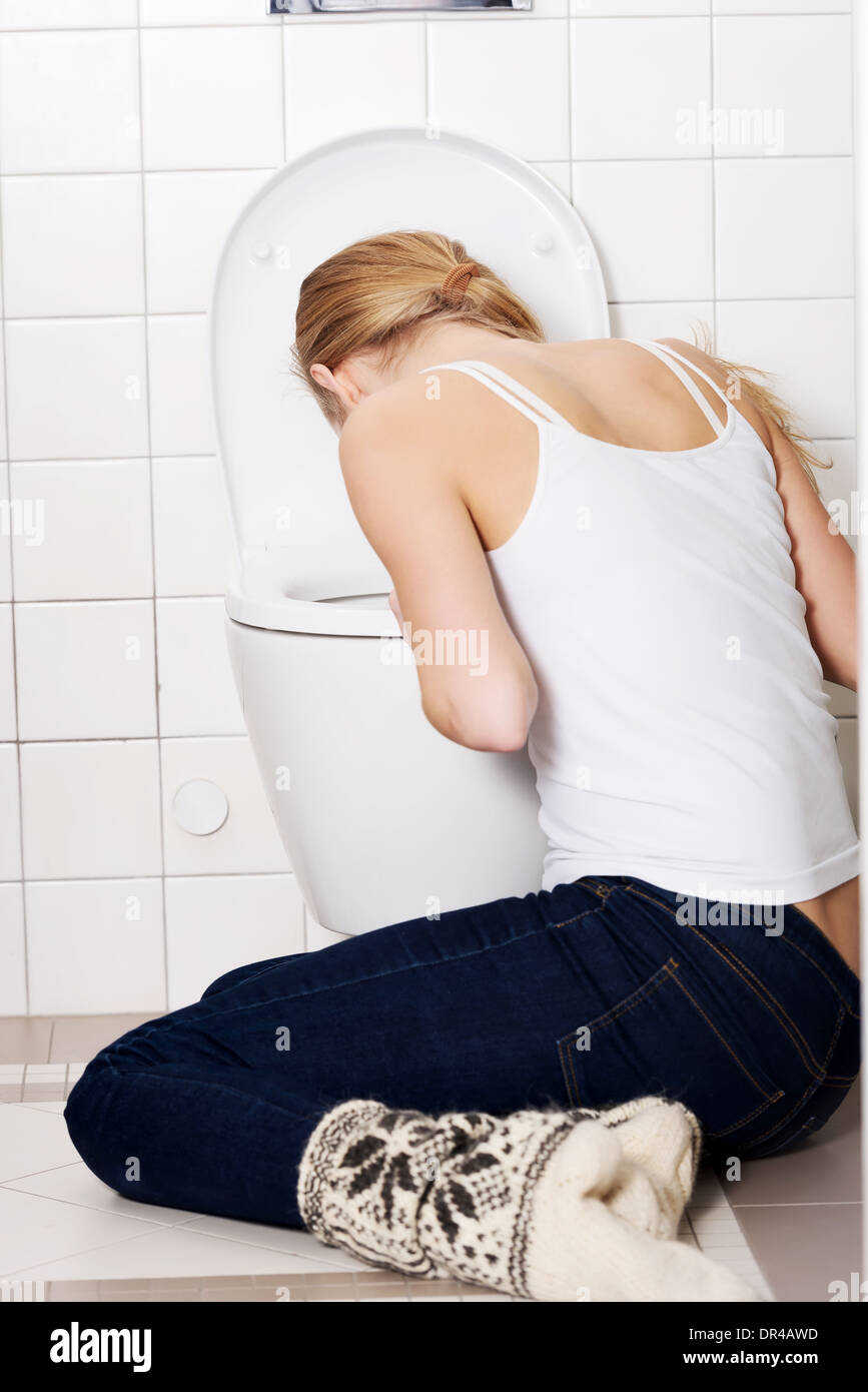 Young Caucasian Woman Is Vomiting In The Bathroom Bulimia Sick Young Caucasian Woman Is Vomiting In The Bathroom Bulimia Sick