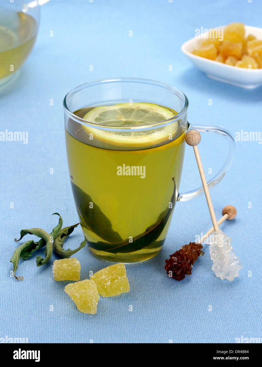 Green tea with sugared ginger and candy canes, close up Stock Photo - Alamy