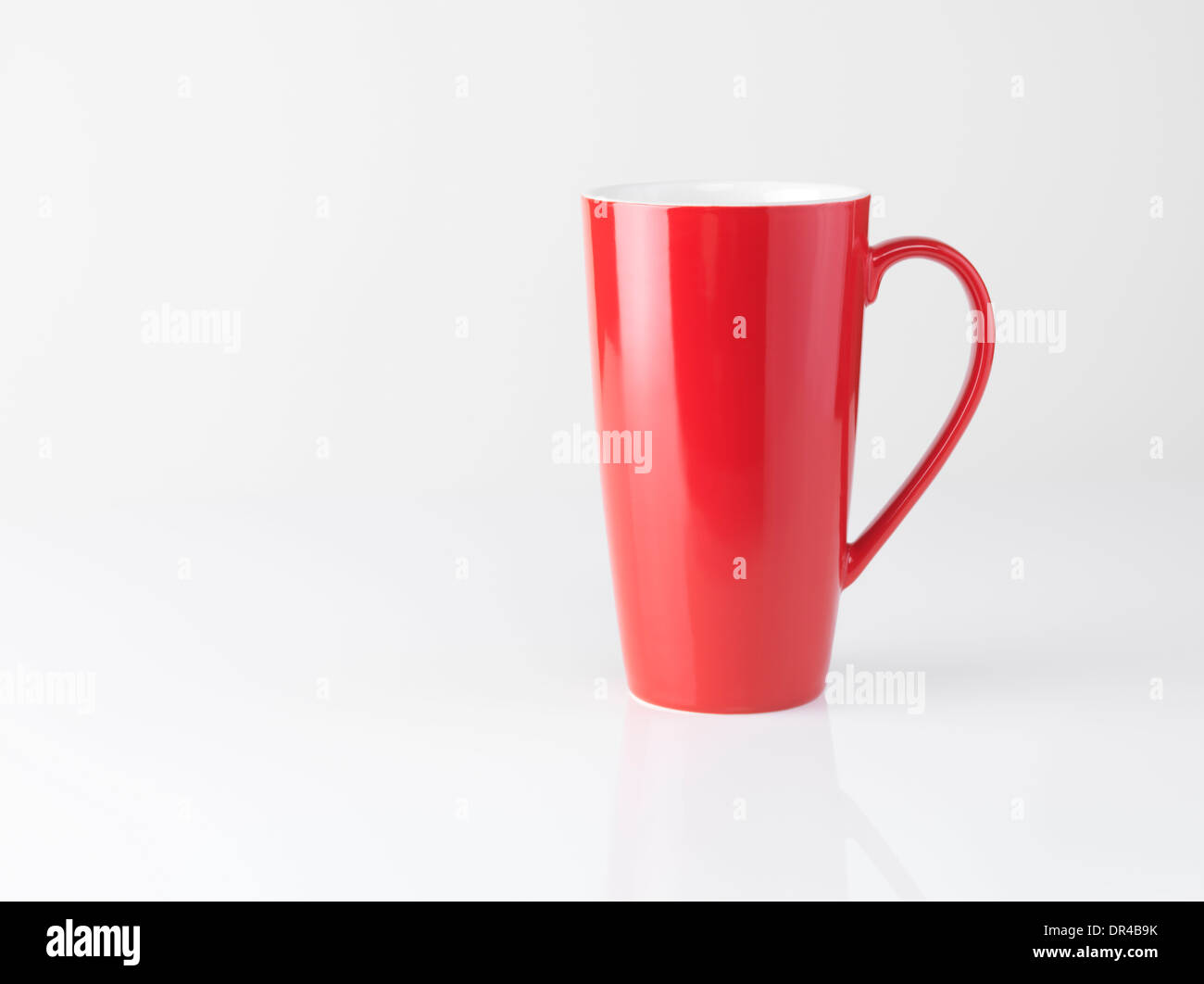 Red tall tea mug isolated on white background Stock Photo - Alamy