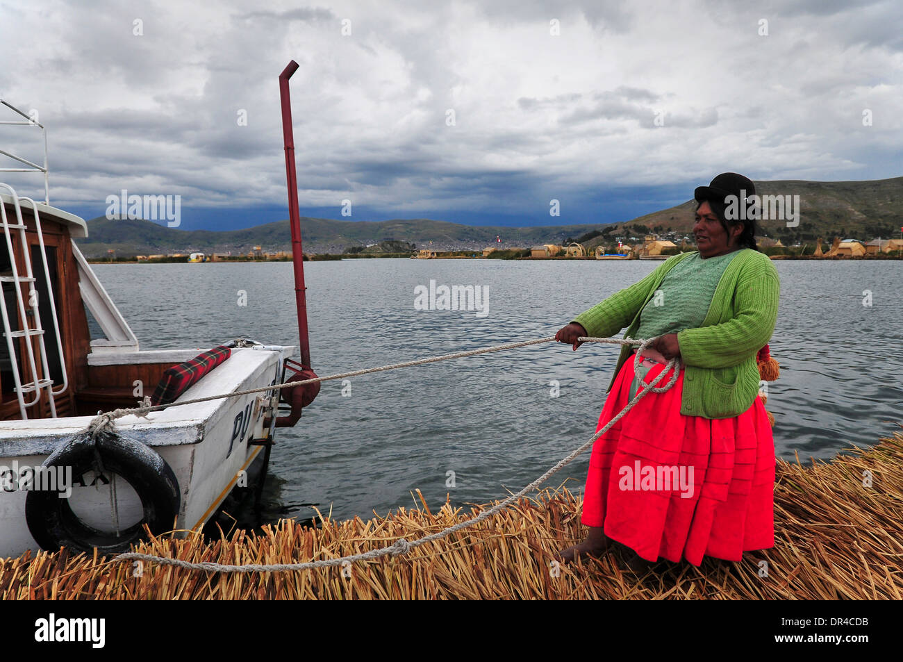 Woman pulling boat Stock Photo - Alamy