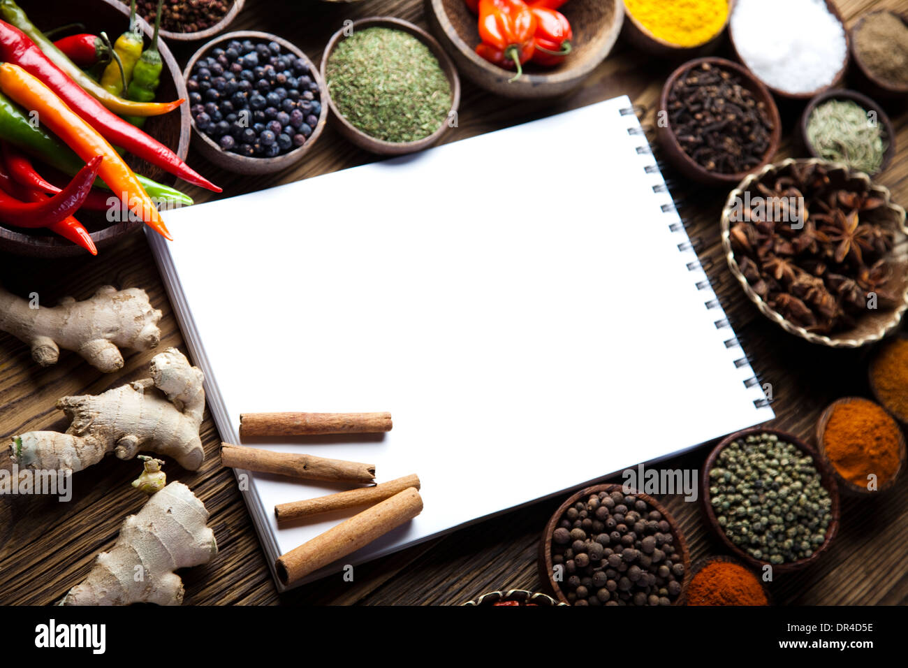 Cookbook and various spices Stock Photo - Alamy