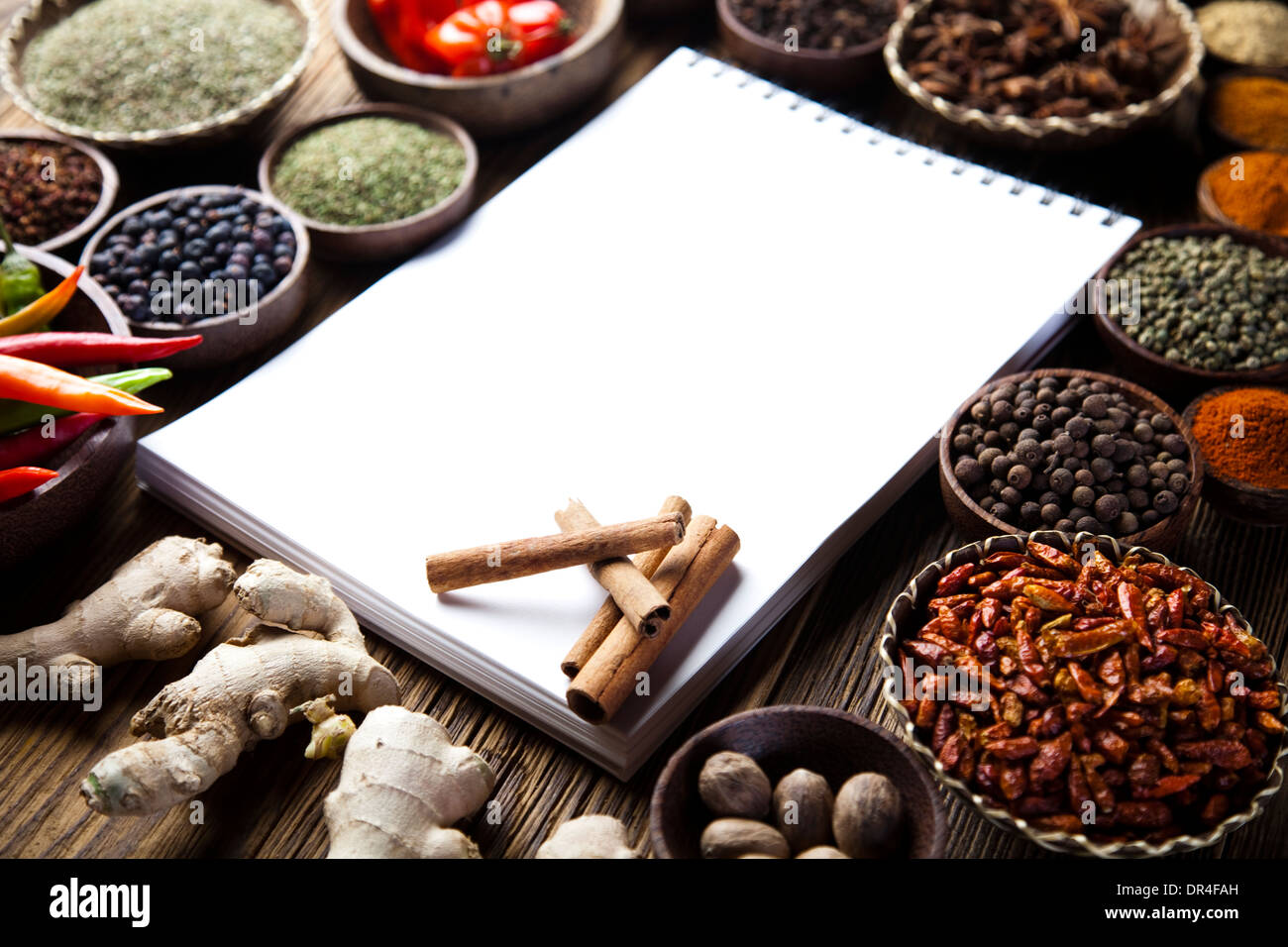 Cookbook and various spices Stock Photo - Alamy
