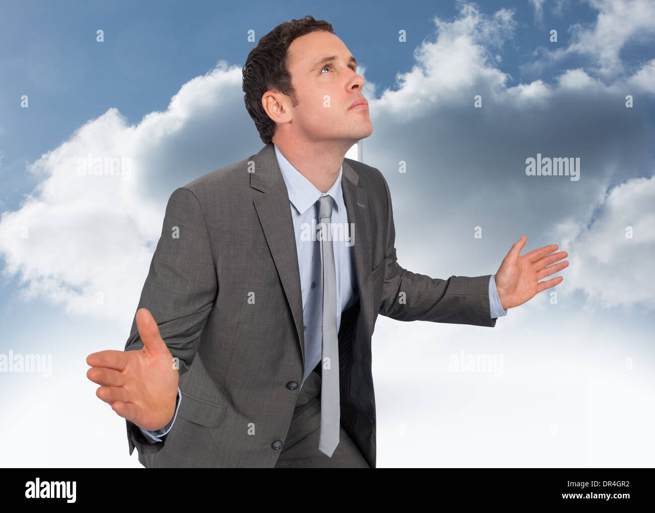 Composite image of businessman posing with hands out Stock Photo - Alamy