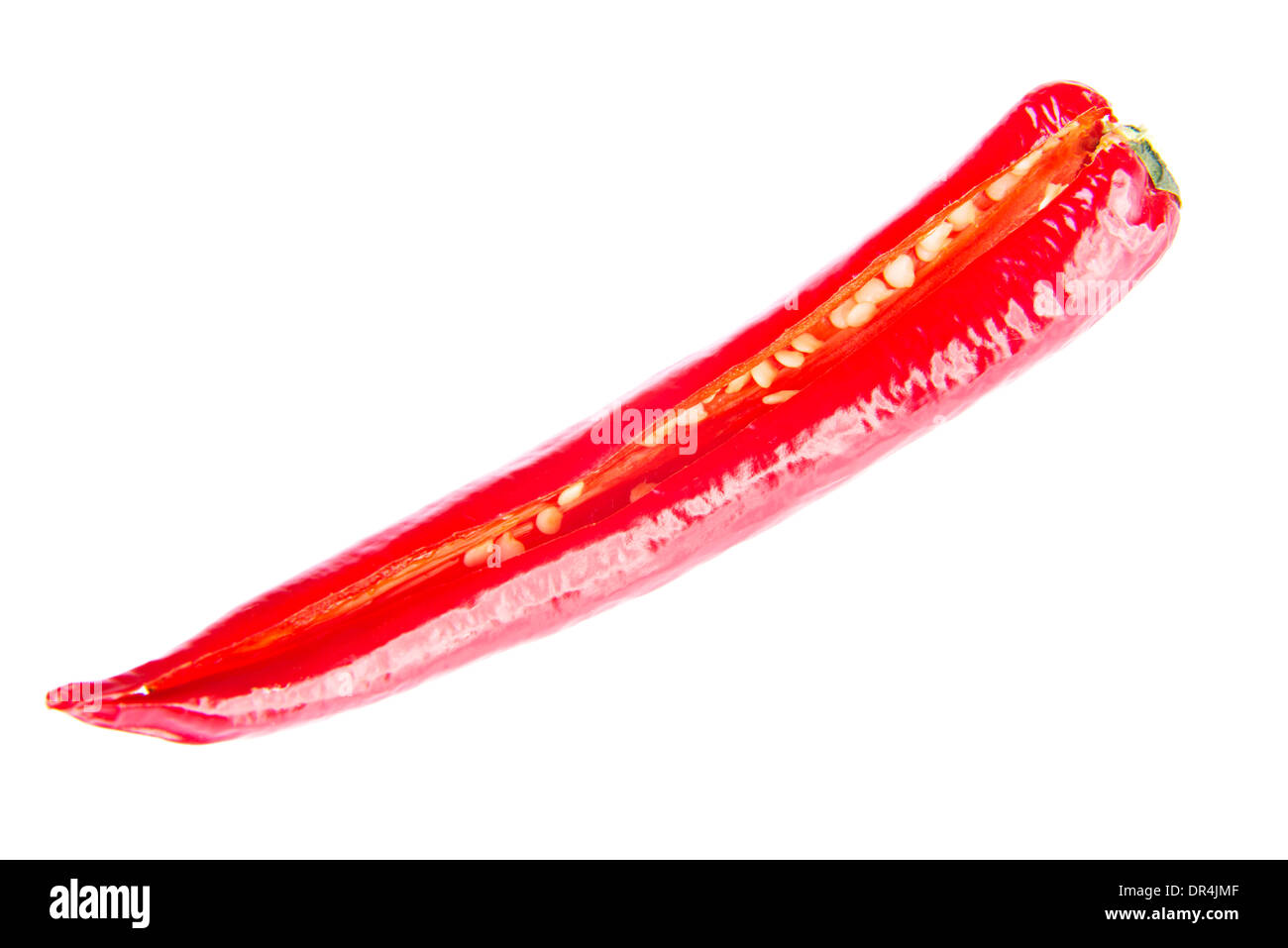 One separated chili pepper cut through lenght. Isolated on white Stock ...