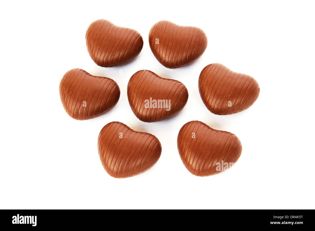 Heart shape chocolates isolated on white background Stock Photo - Alamy